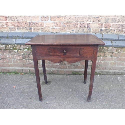 AN 18th CENTURY OAK SIDE TABLE with narrow single drawer and serpentine ...