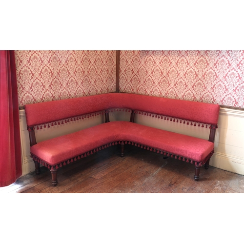 A MAHOGANY CORNER SETTLE 20th century, the square back with red floral ...