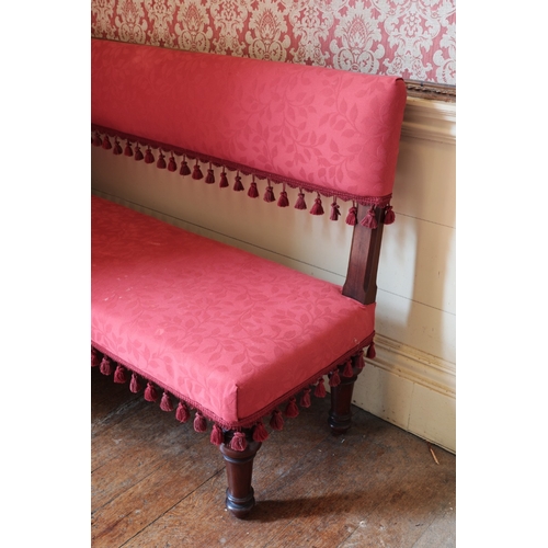 A MAHOGANY CORNER SETTLE 20th century, the square back with red floral ...