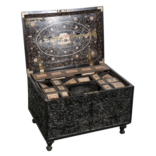 AN ANGLO-CEYLONESE EBONY AND IVORY INLAID GAMES CHEST the exterior ...