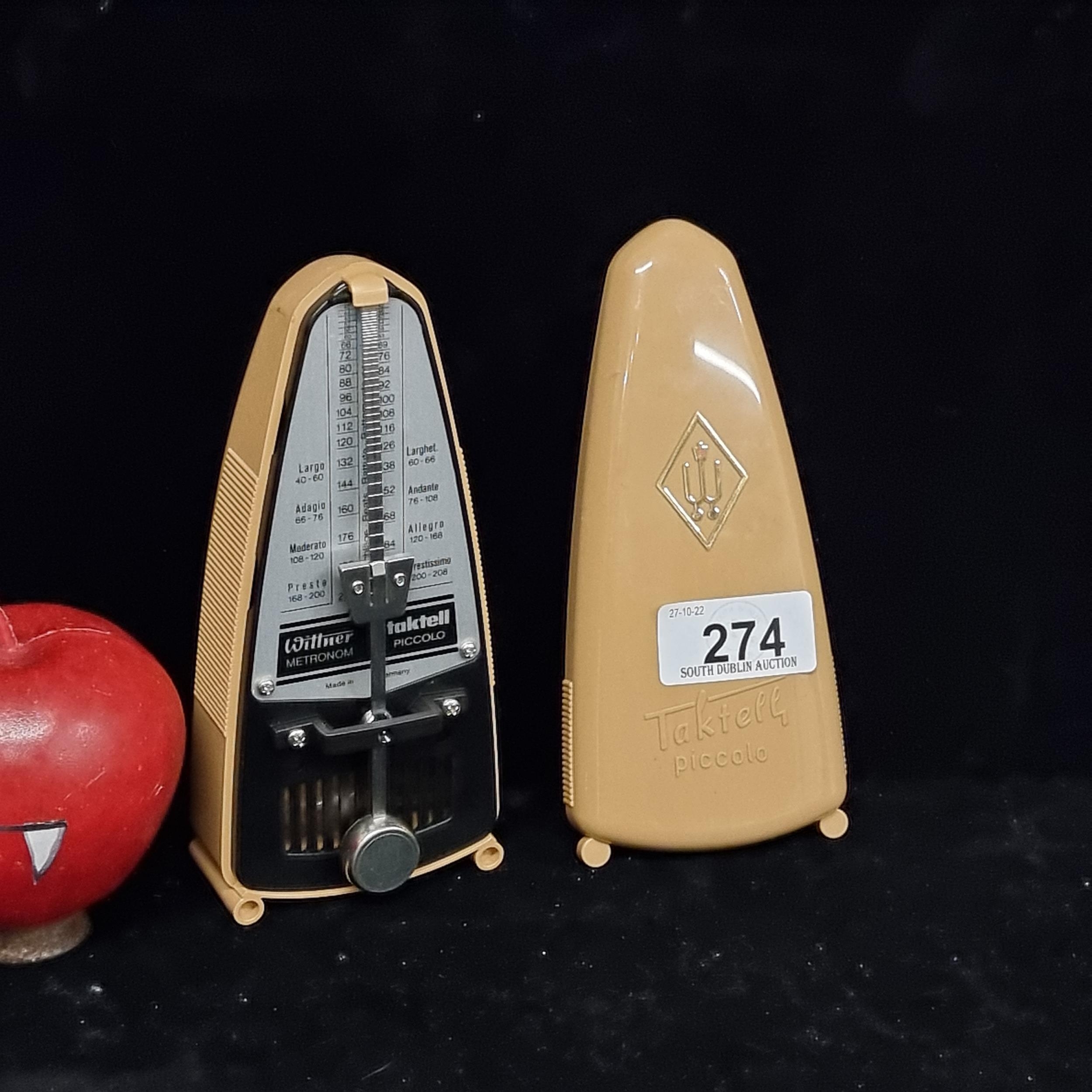 A Wittner Taktell Piccolo metronome, made in Germany with original cover.