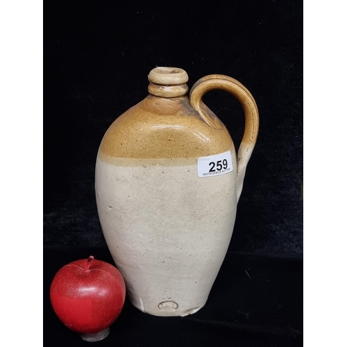An unusual antique stoneware ceramic flagon with indistinct maker's ...