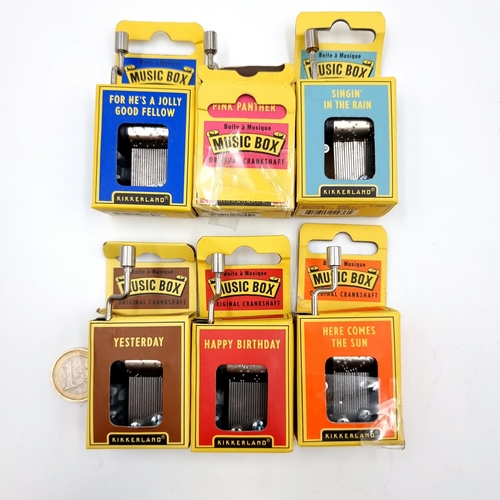 A collection of six Kikkerand miniature music boxes, all in working ...