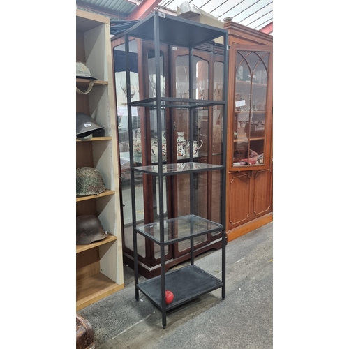 A stylish contemporary shelving unit. Consisting of a matte black metal ...