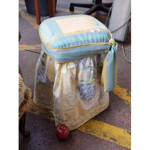 A charming rustic wooden stool. Upholstered with a floor length apron ...