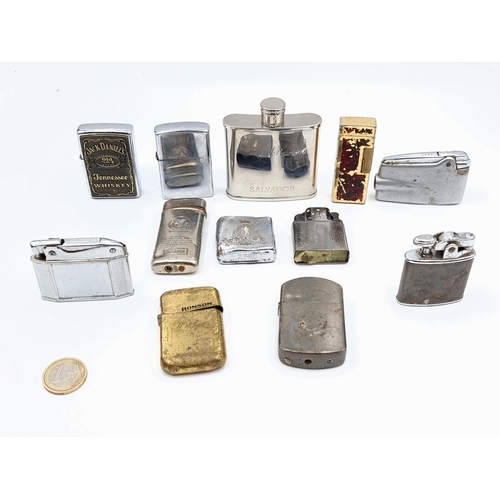 A nice collection of six lighters together with a WIN gas lighter, a ...