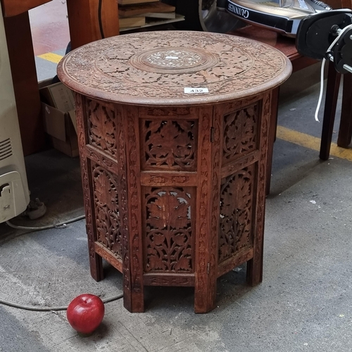 A lovely profusely carved folding Middle Eastern wooden side table ...