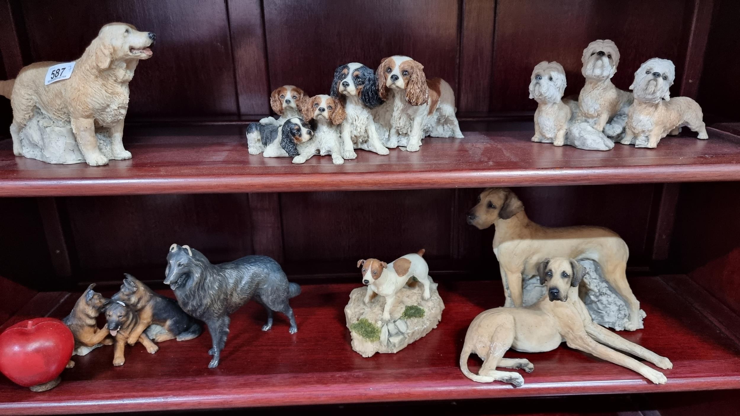 A selection of seven collectable dog figures and dog group sculptures ...