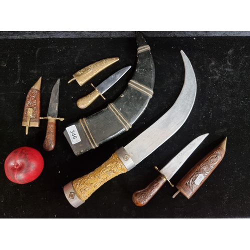 A fascinating collection of 4 Indian daggers with carved wood and brass ...