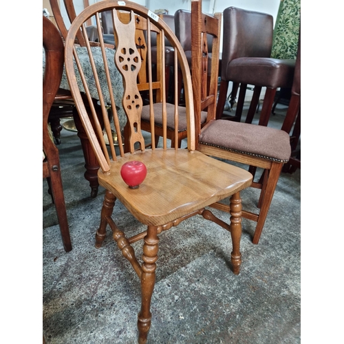A gorgeous antique wheelback dining chair with spindle and wheel motif ...