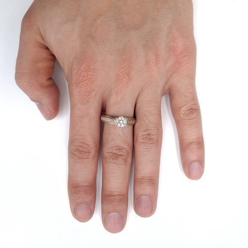 An antique diamond cluster ring set in a crown mount with diamond ...