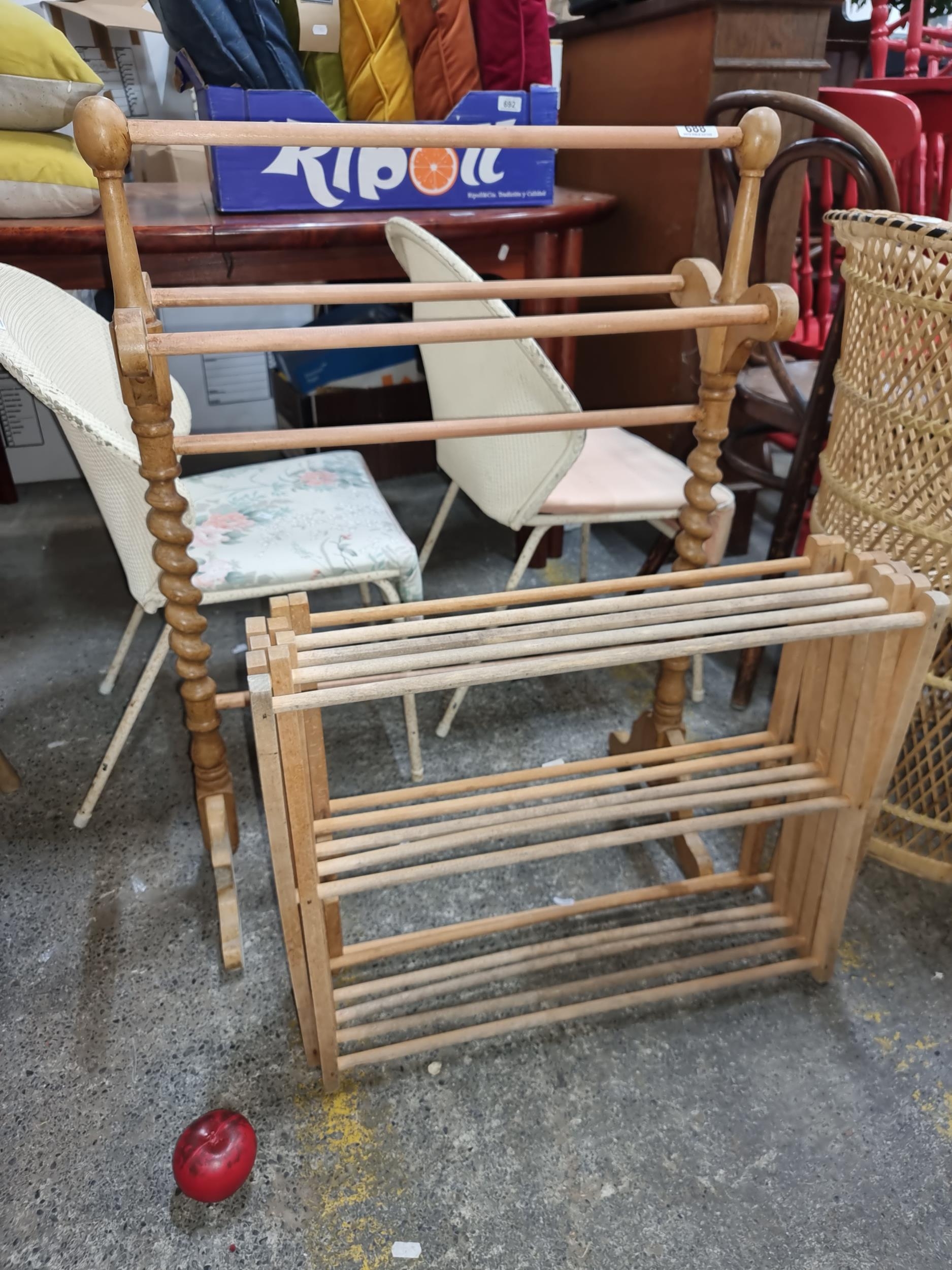 A lovely carved oak quilt rack with barley twist columns to sides ...