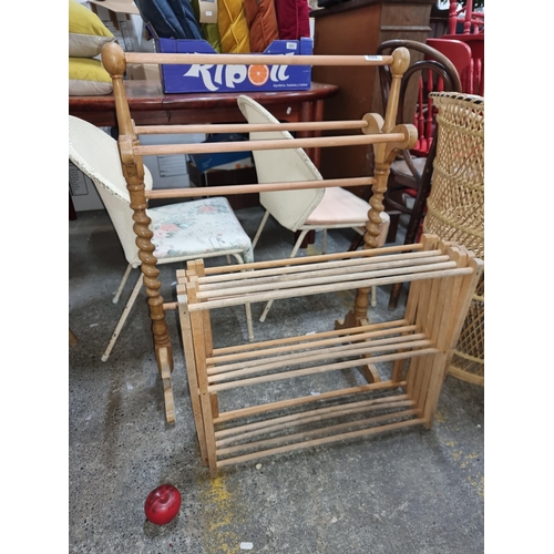 A lovely carved oak quilt rack with barley twist columns to sides ...