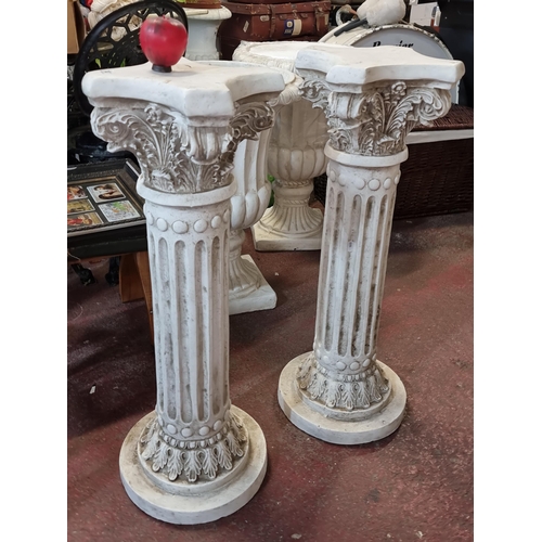 SA pair of robust yet lightweight ornate Corinthian-style columns.