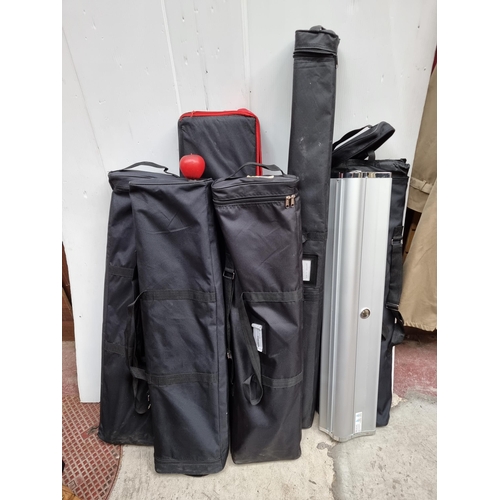 Six commercial pull up advertising displays in carrying cases.