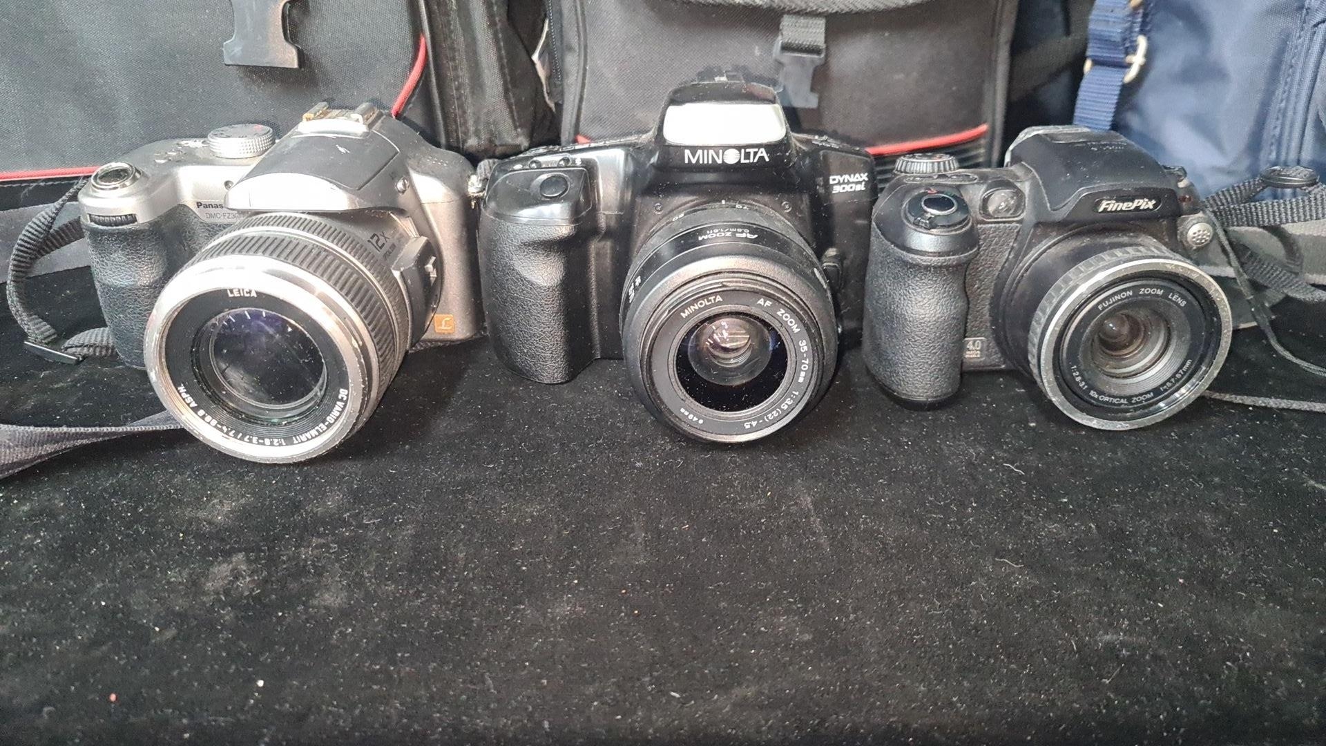 A splendid collection of three cameras, including Panasonic, Minolta ...