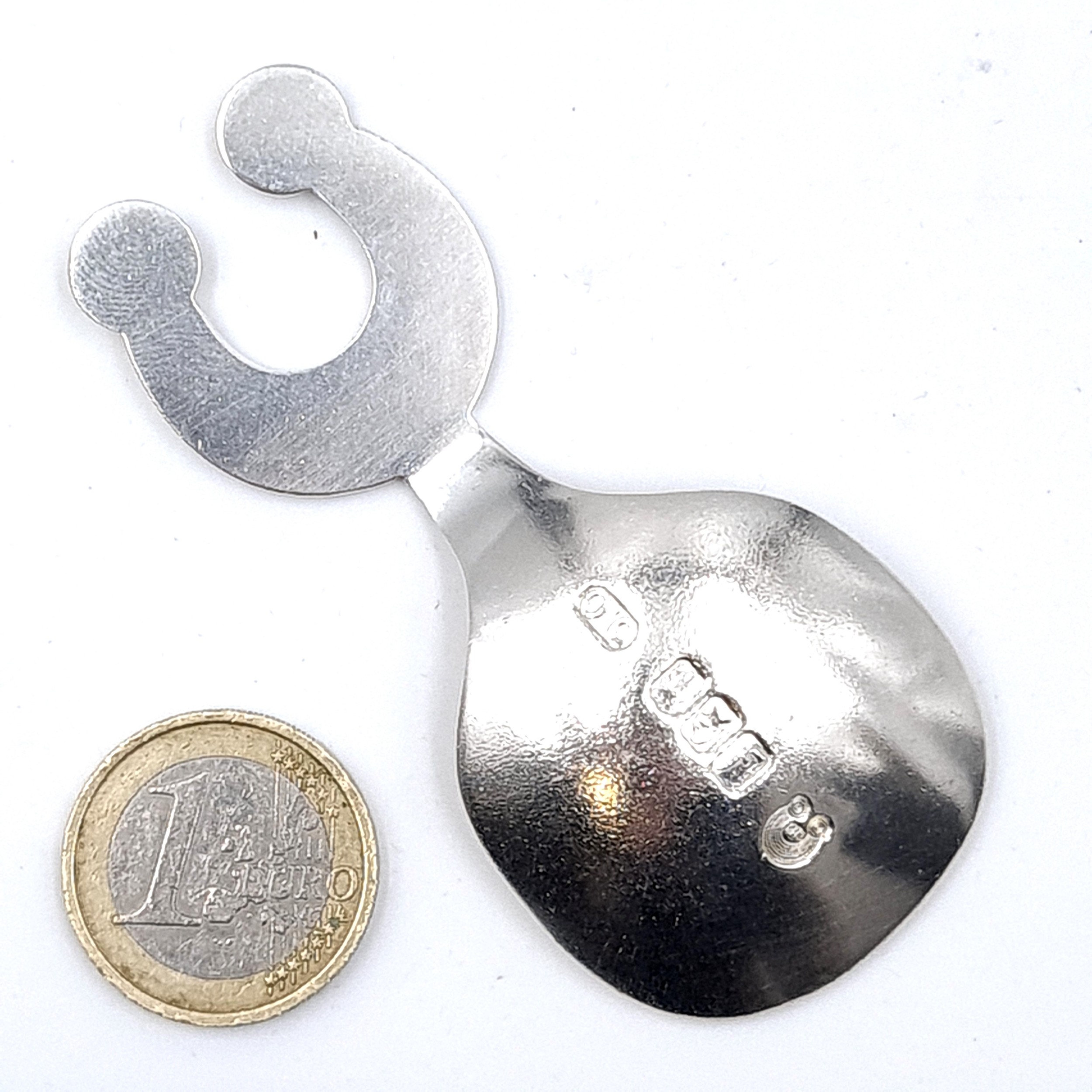 A sterling silver torc caddy spoon with 1973 EEC commemorative ...