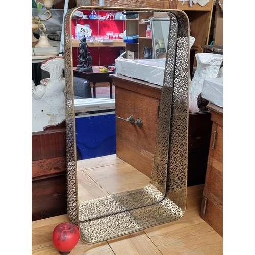 A fabulous ornate box frame wall mirror featuring an unusual pierced frame.