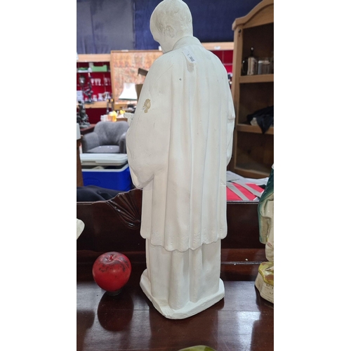 A traditional mold sculpted religious Saint figure.