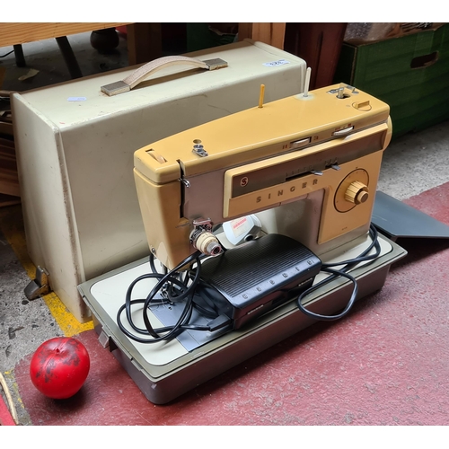 A lovely vintage Singer sewing machine including foot pedal and ...