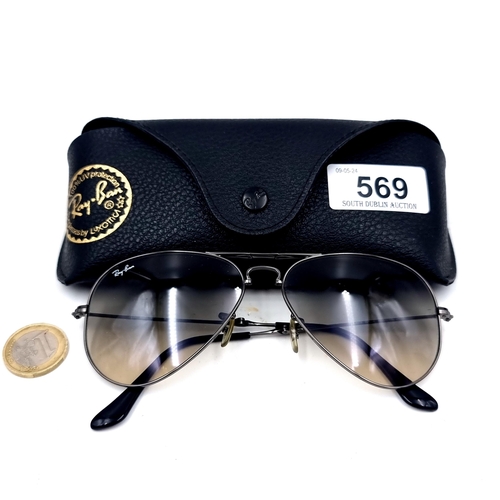 A pair of aviator Ray-Ban sunglasses with folding collapsible frames ...