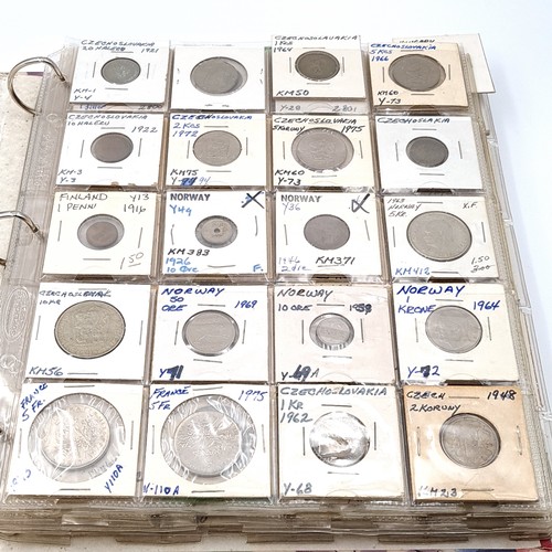 A world coin album of over 160 coins. Most mounted in with date and ...
