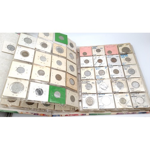 A world coin album of over 160 coins. Most mounted in with date and ...