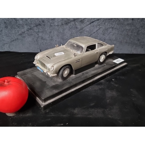 A scale model of an Aston Martin DB5, featuring detailed craftsmanship ...