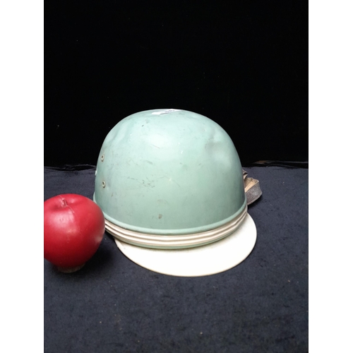 A vintage pale blue motor racing helmet