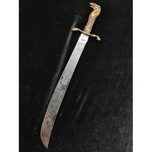An interesting decorative sword with brass toned handle in the shape of ...