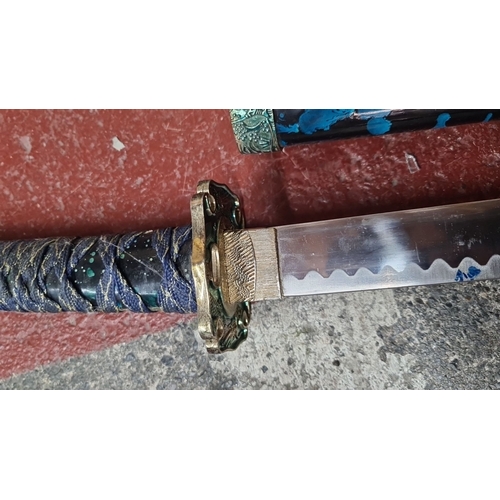 Set of three Japanese-style swords with matching black and blue ...