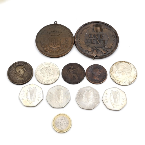 A collection of coins consisting of four Irish millennium coins, a one ...