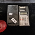 A vintage Brother TP -1 printing calculator and case.