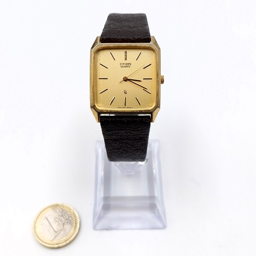 A gents Citizen quartz wristwatch with sweep second hand and leather ...