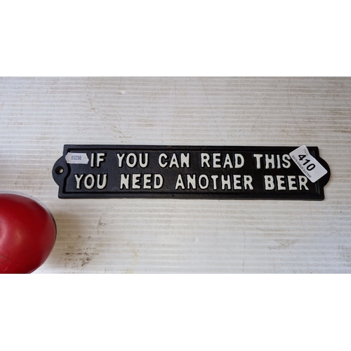 A Cast iron sign, humorous text: "IF YOU CAN READ THIS YOU NEED ANOTHER ...
