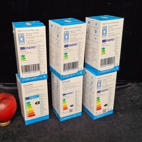 Six boxed TP-Link Tapo dimmable smart light bulbs, including one ...