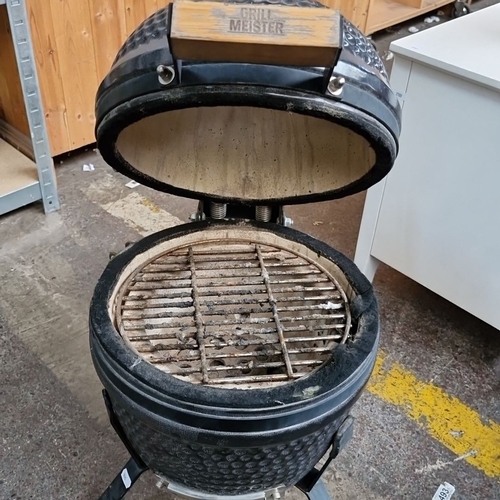 Black ceramic kamado-style tabletop charcoal barbecue by Grill Meister ...