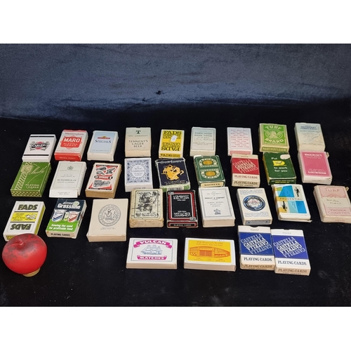 A box of vintage advertising playing card decks. Including "Turf ...