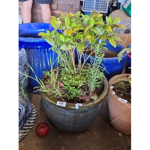 Blue-grey glazed stoneware planter of rounded tapering form, housing ...