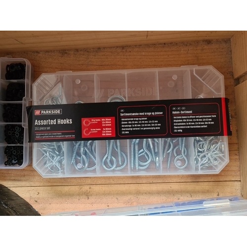 Wooden tray holding Parkside 151-piece assorted hooks set, Powerfix ...
