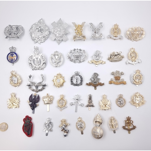 A box of military cap badges.