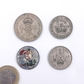 Four British coins including a 1901 shilling, 1947 two shillings, 1949 one shilling and a 1948 one s