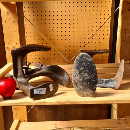 Two early 20th-century cast-iron cobbler’s shoe lasts, comprising an ...