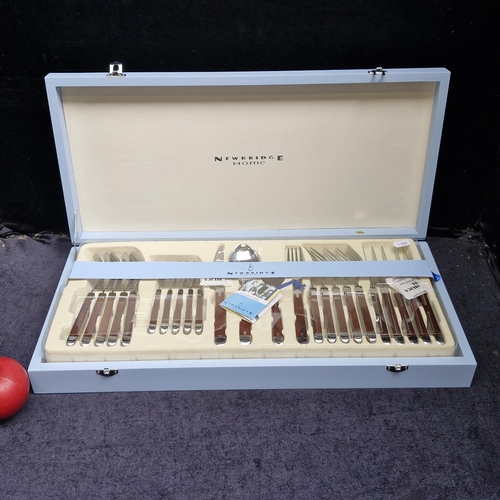 A Newbridge Home premium 24 piece steak set, unused, in original case.