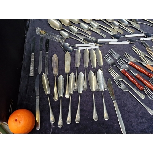 Assorted flatware, early–mid 20th century, approximately ninety pieces of silver-plated and stainles