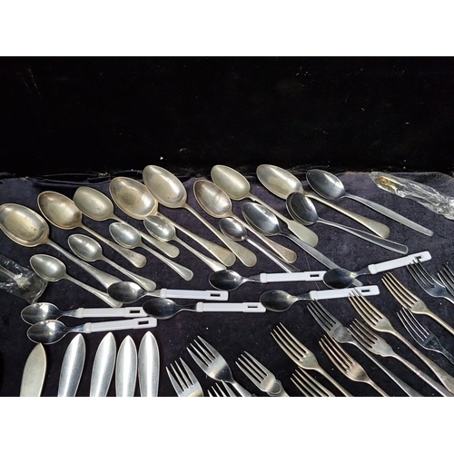 Assorted flatware, early–mid 20th century, approximately ninety pieces of silver-plated and stainles