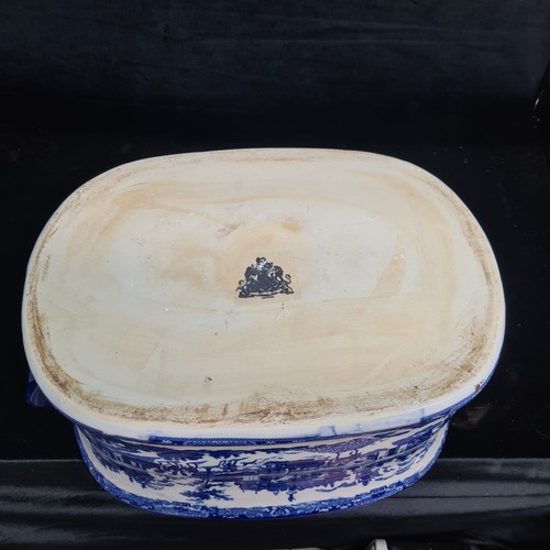 A large blue and white ceramic foot bath also known as an ironstone ...