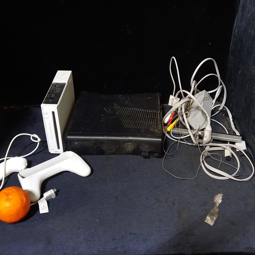 Group of two home video game consoles comprising a white Nintendo Wii ...