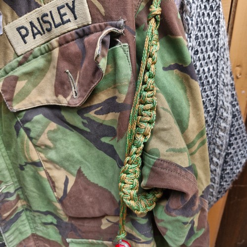 A British Army disruptive pattern material jacket with Swiss Army knife ...