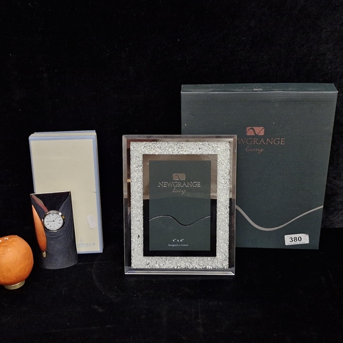 A Newbridge Silver desk clock and a Newgrange Living 4" by 6" picture ...
